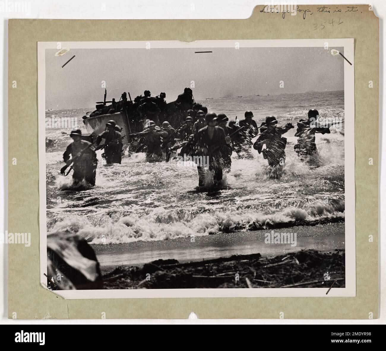 U.S. Coast Guard-manned landing barges transport troops to the beaches ...
