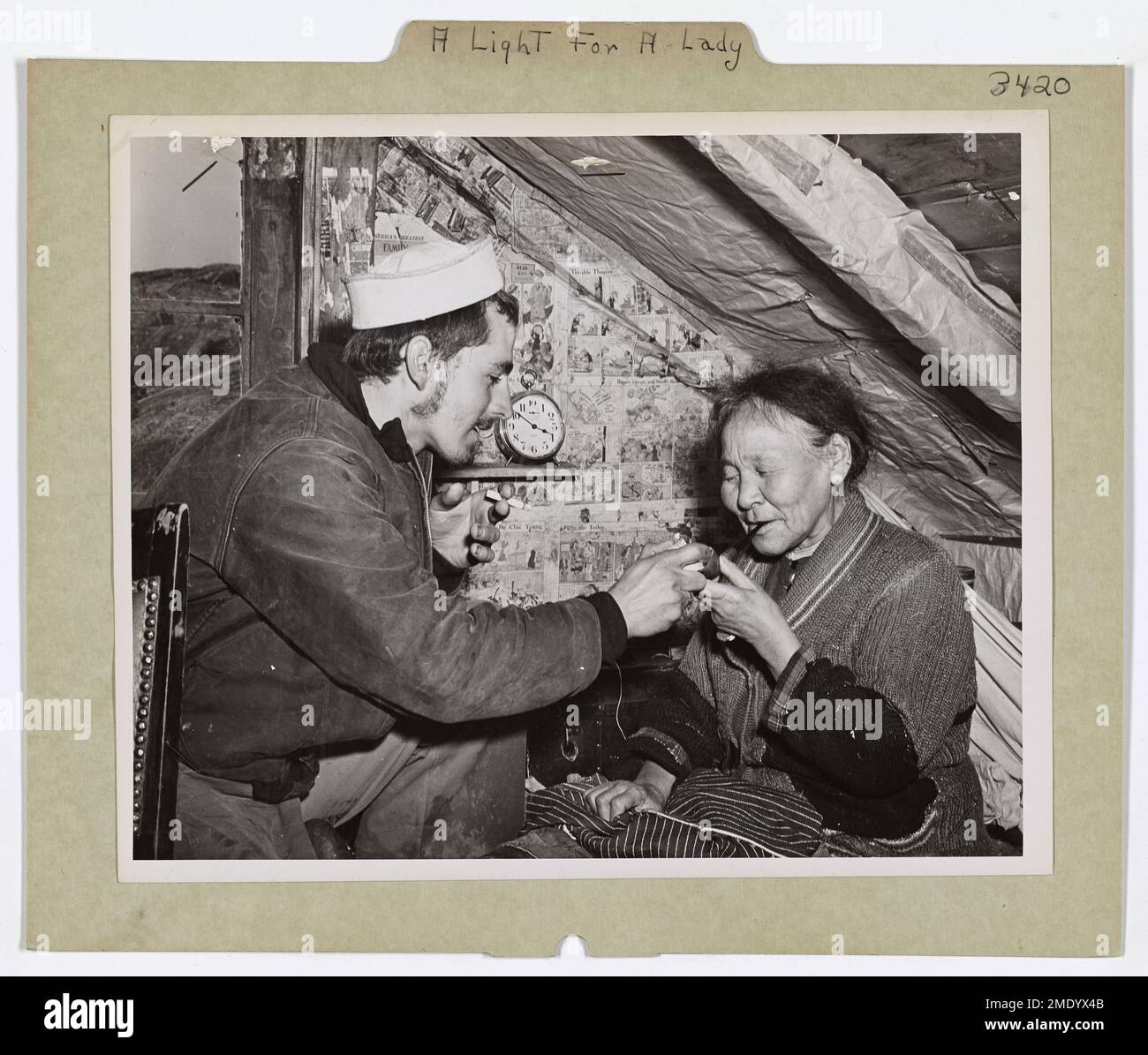 A Light for a Lady. This image depicts Coast Guardsman John F ...