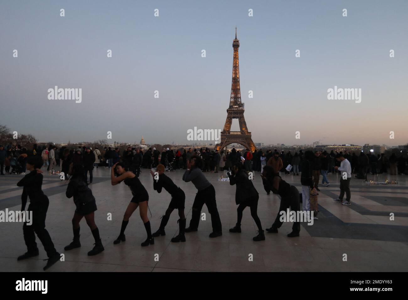 People dance in front of the Eiffel Tower on the Trocadero square in ...
