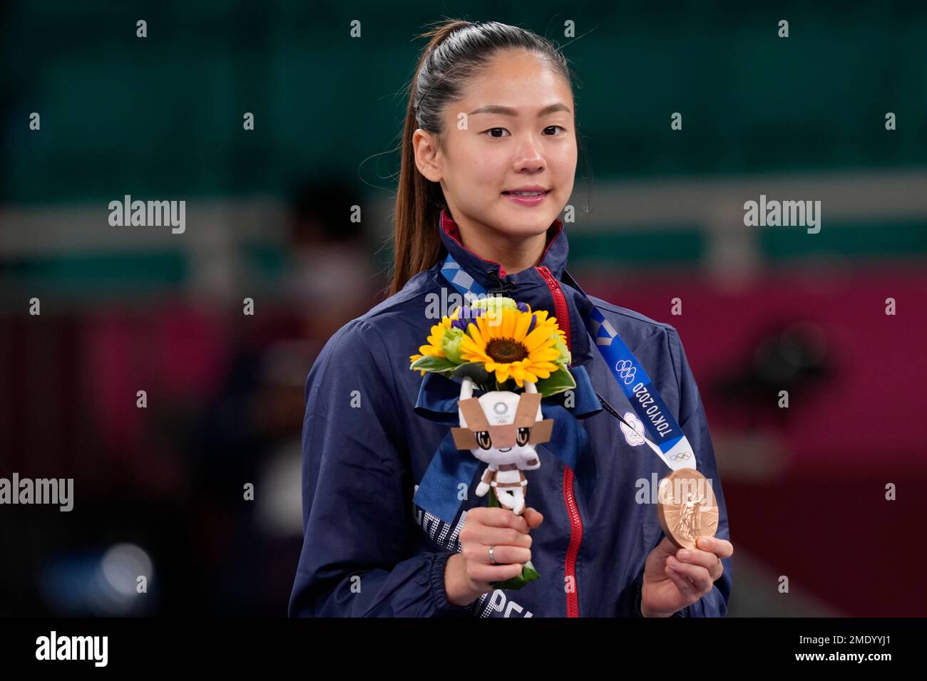 Bronze medalist Wen Tzu-yun of Taiwan celebrates with her medal during ...
