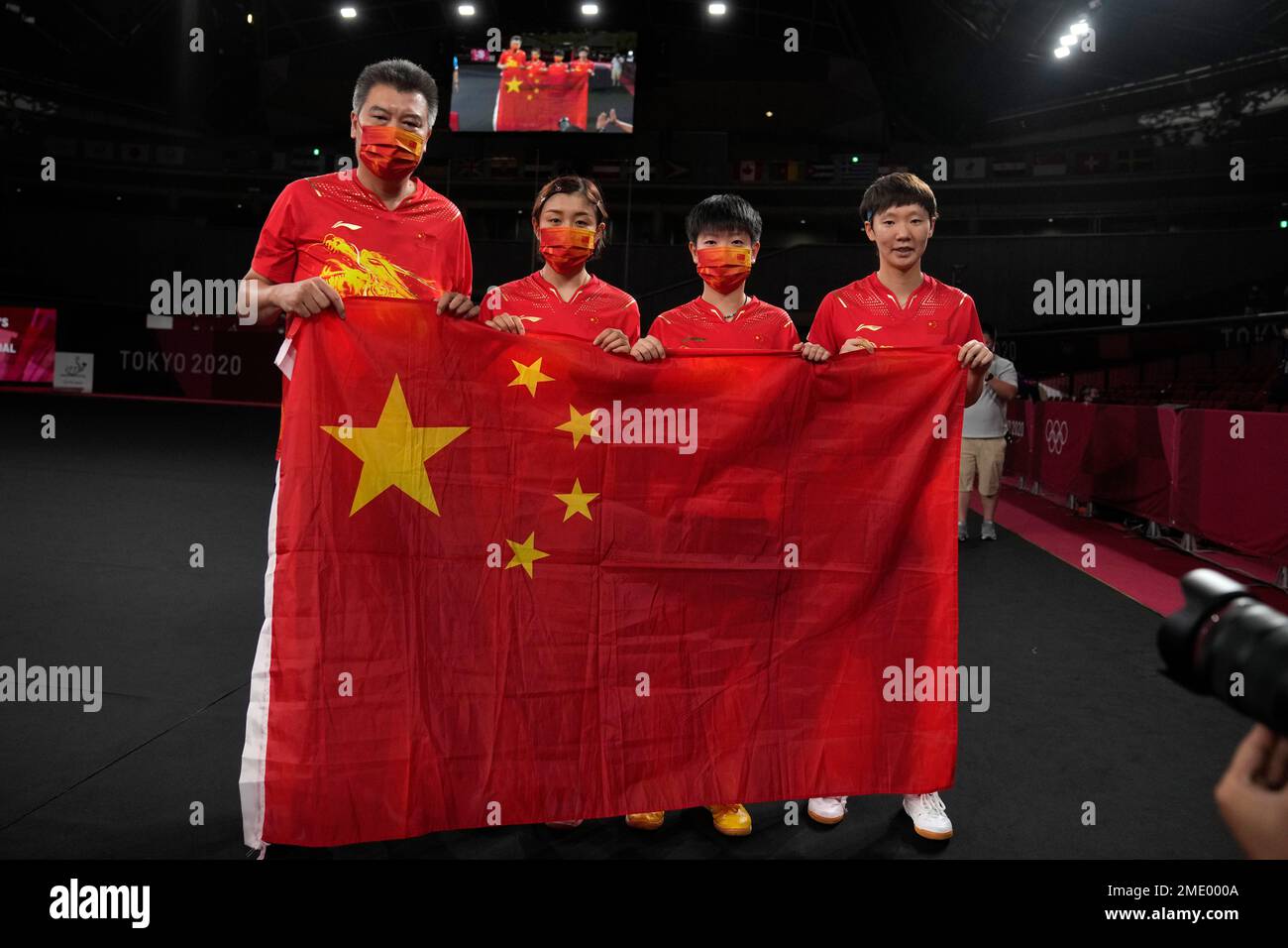 From left, coach Li Sun, Chen Meng, Sun Yingsha, and Wang Manyu of ...