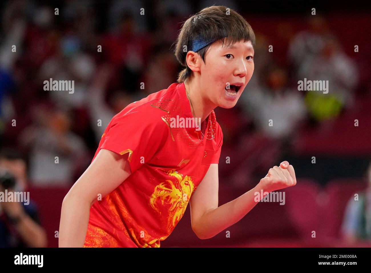 Wang Manyu of China reacts while competing during her table tennis ...