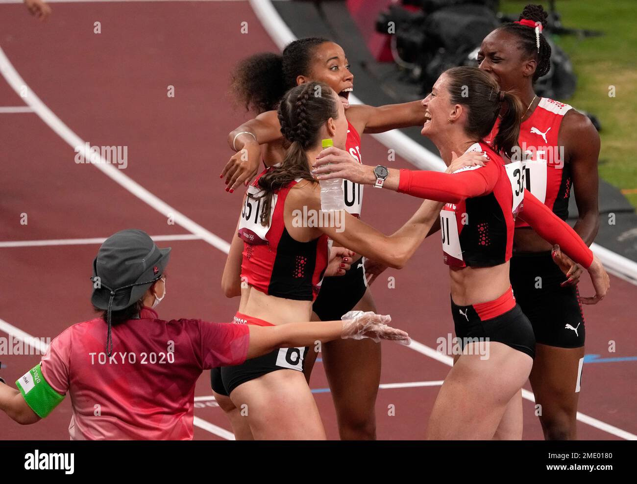 The Swiss team celebrate after a semifinal of the women's 4 x 400-meter ...