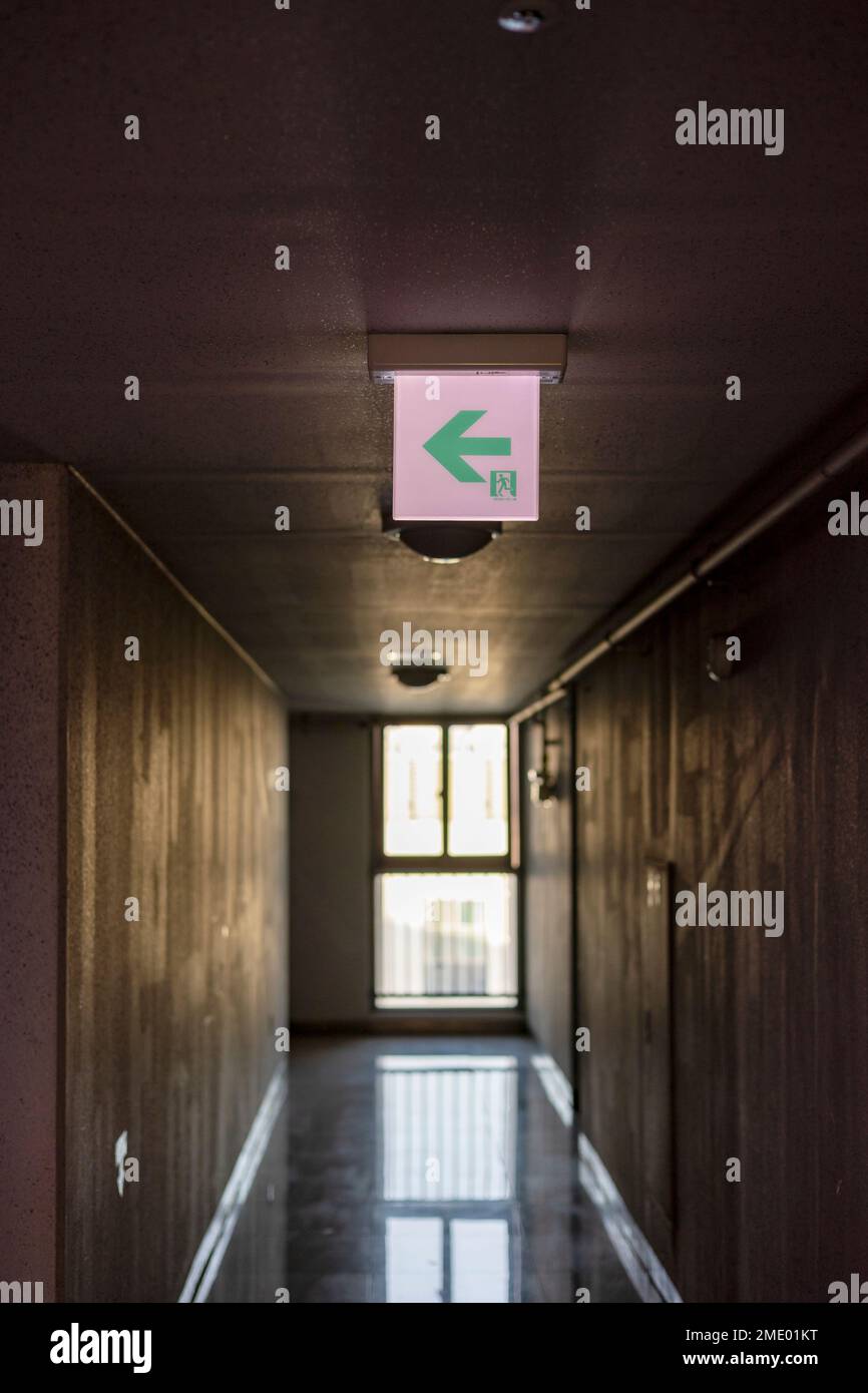 Emergency exit sign at the hallway of building Stock Photo - Alamy