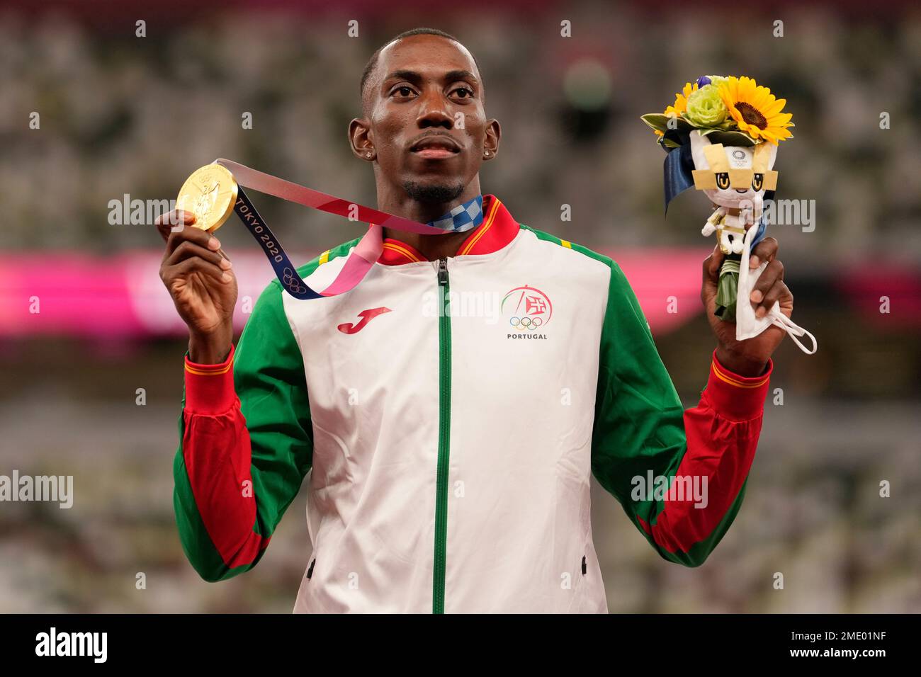 Gold medalist Pedro Pichardo, of Portugal, poses during the medal ceremony for the men's triple ...