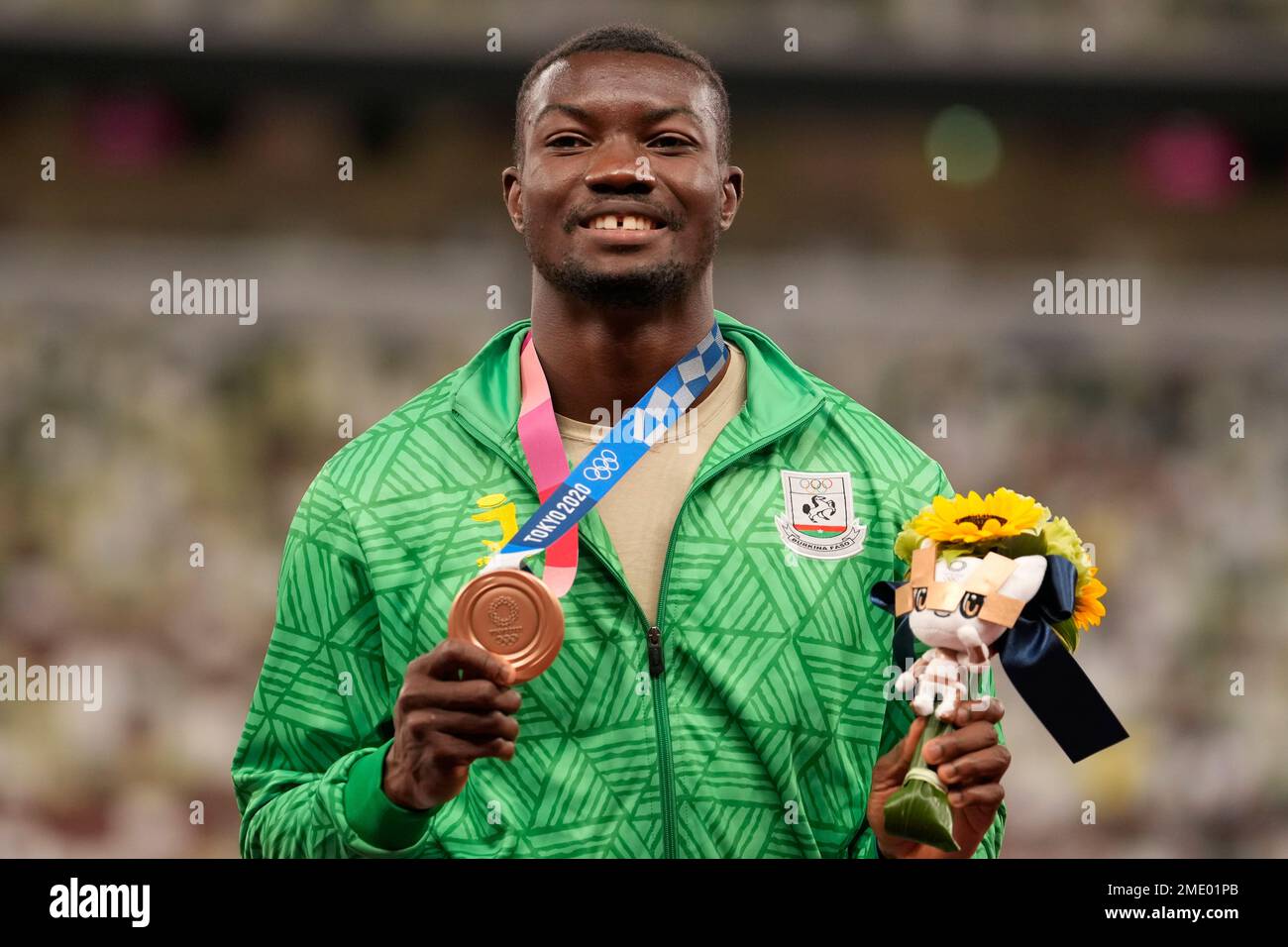 Bronze medalist Hugues Zango, of Burkina Faso, poses during the medal ...