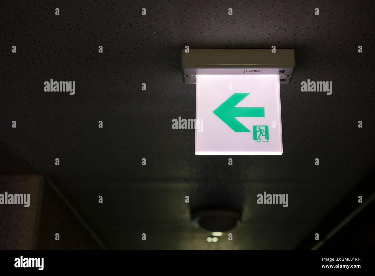 Emergency exit sign at the hallway of building Stock Photo - Alamy