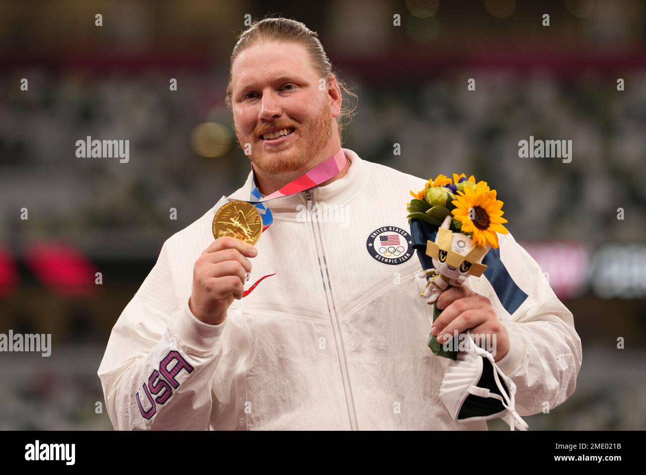 Gold medalist Ryan Crouser, of the United States, poses during the ...