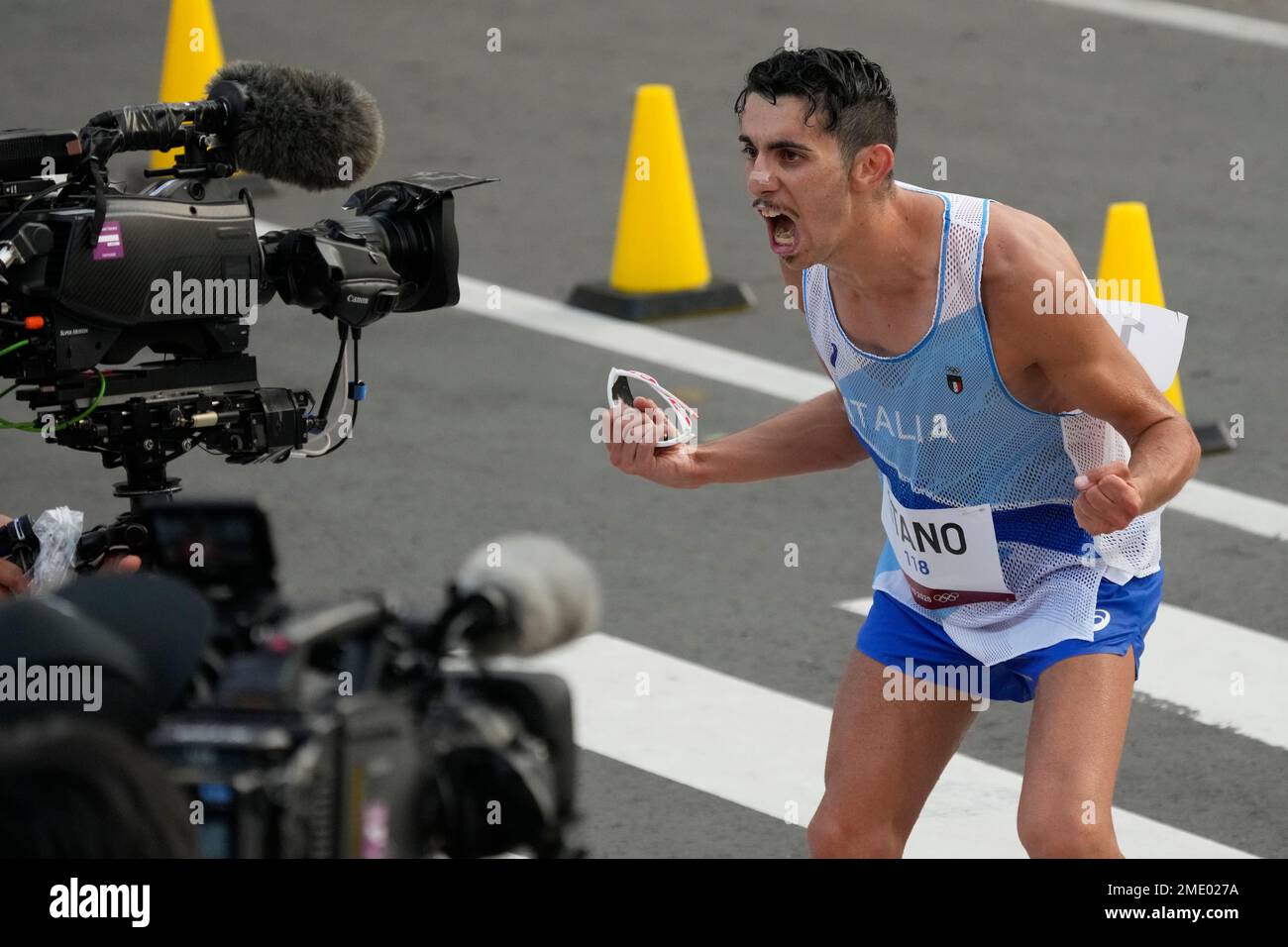 Massimo Stano, of Italy, exults after finishing first in the men's 20km ...