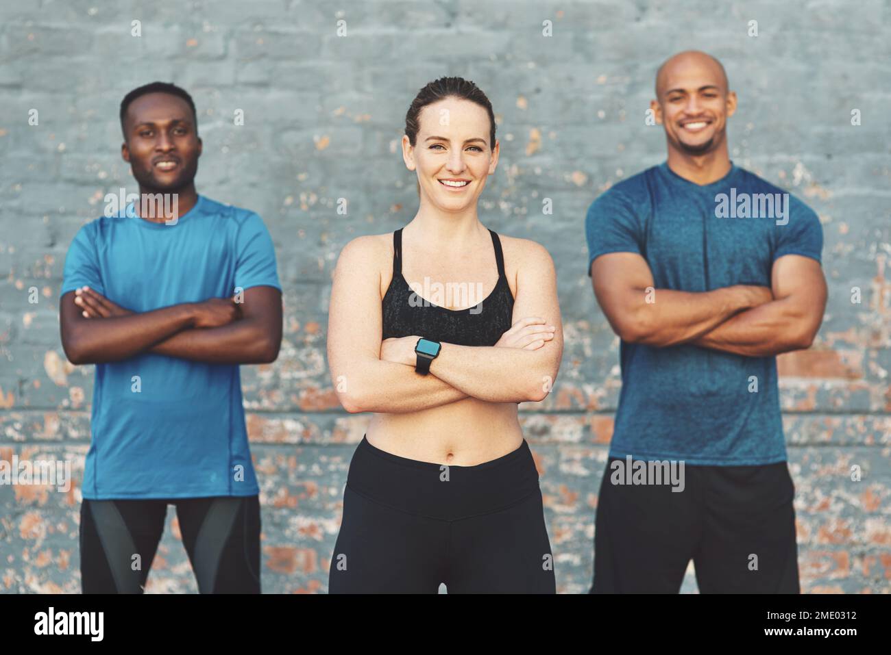Did you workout today. three sportspeople standing together Stock Photo ...