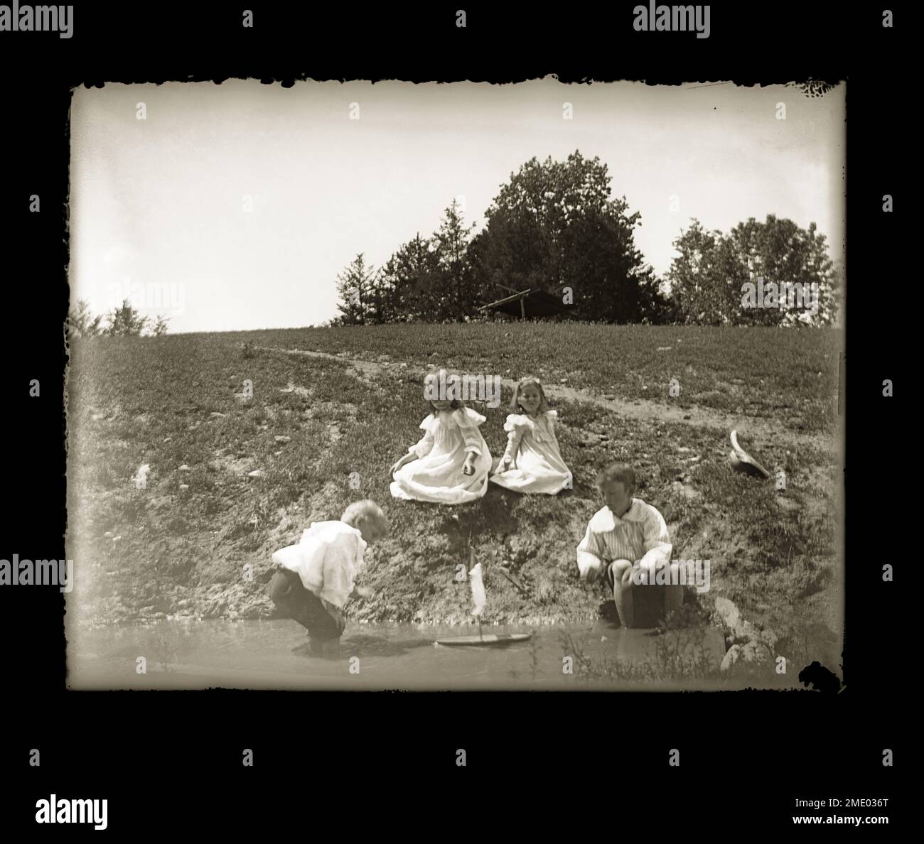 Victorian-era Children Playing with a Toy Boat, Circa 1890 Stock Photo ...