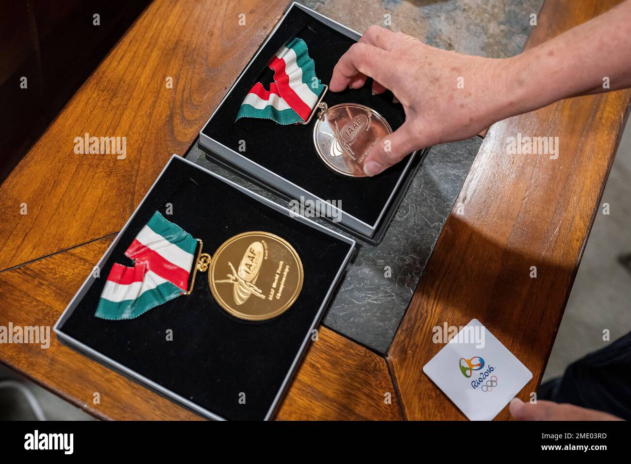 Lisa Crouser displays Ryan Crouser's World Youth Championship medals ...