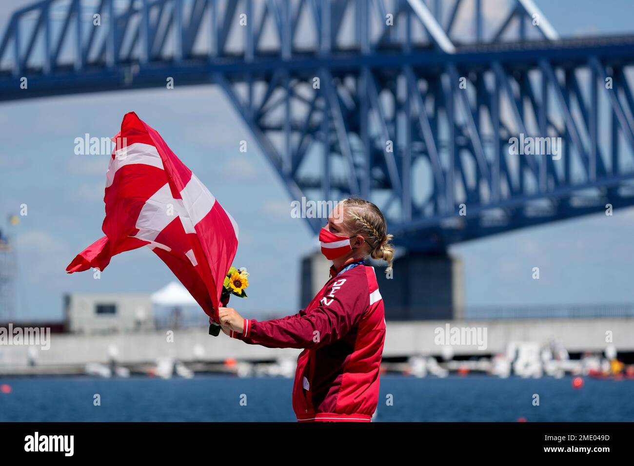 Denmark's Emma Aastrand Jorgensen waves the Danish flag after winning ...