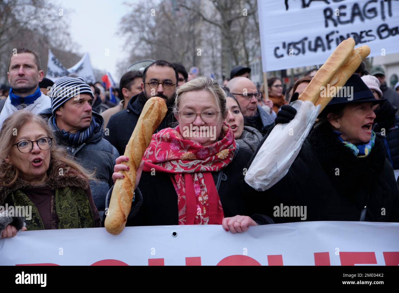 Paris, France. 23rd Jan, 2023. A woman holds a bread in the air during ...