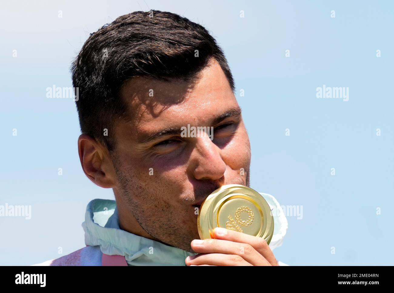 Sandor Totka, of Hungary, kisses his gold medal in the men's kayak ...