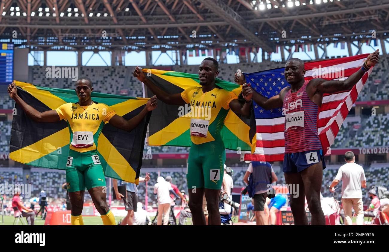 Hansle Parchment, of Jamaica, center, celebrates winning the gold medal ...