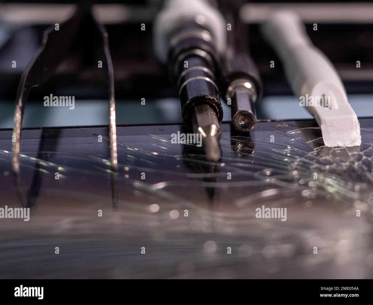 Old broken smartphone and repair tool. The concept of computer equipment, mobile phones ...