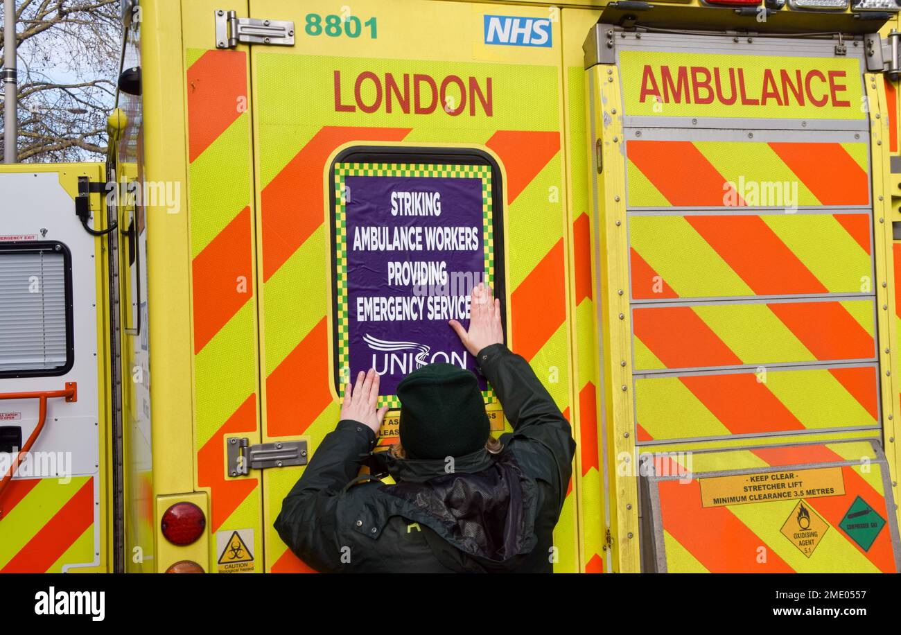 London, England, UK. 23rd Jan, 2023. An ambulance worker sticks a sign ...