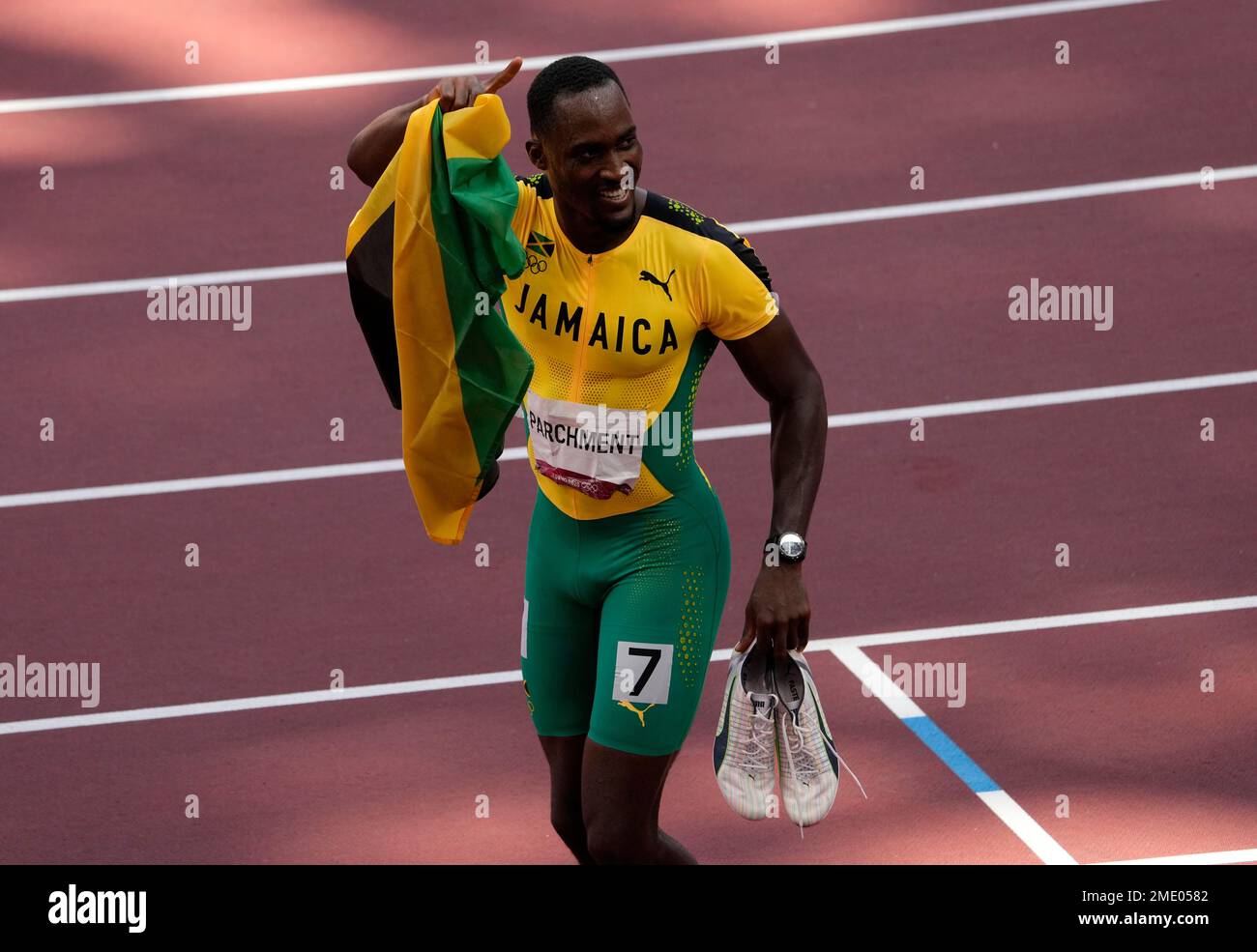 Hansle Parchment, of Jamaica celebrates winning the gold medal in the ...