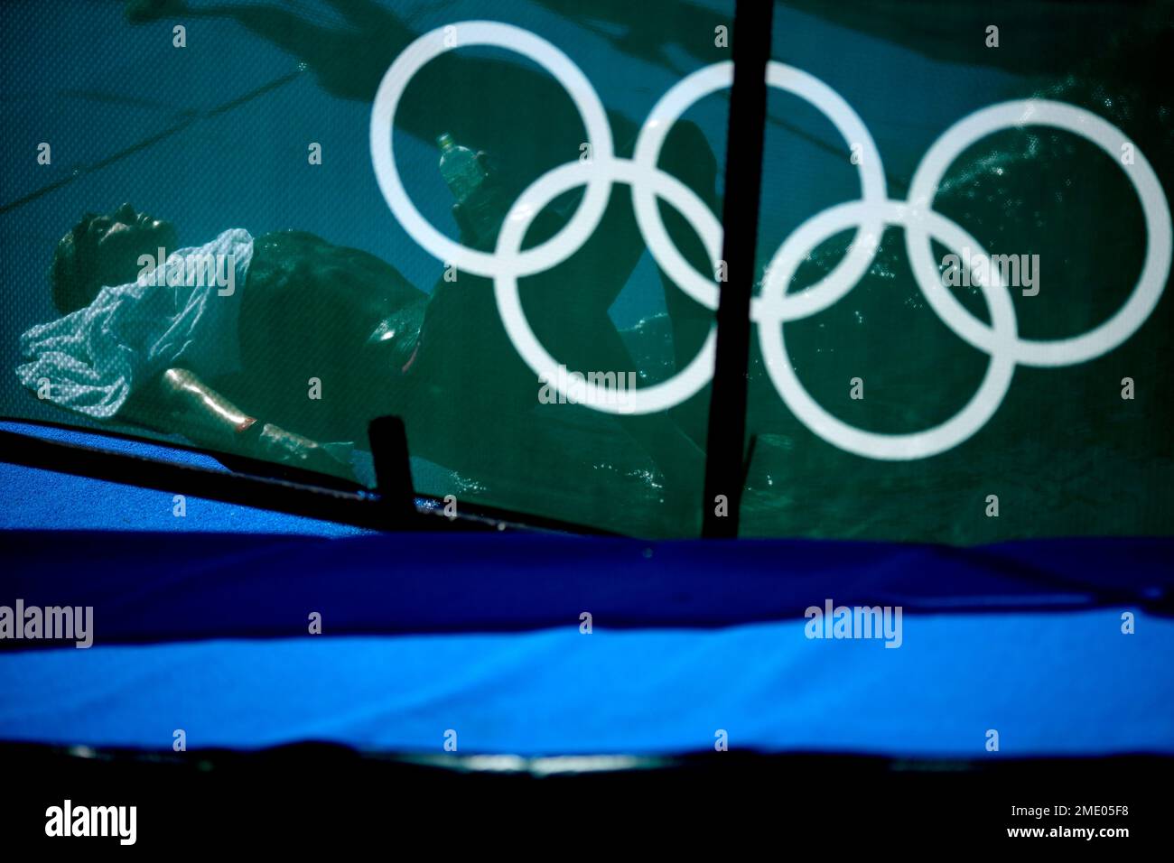 Florian Wellbrock, of Germany, rests after winning the men's marathon ...