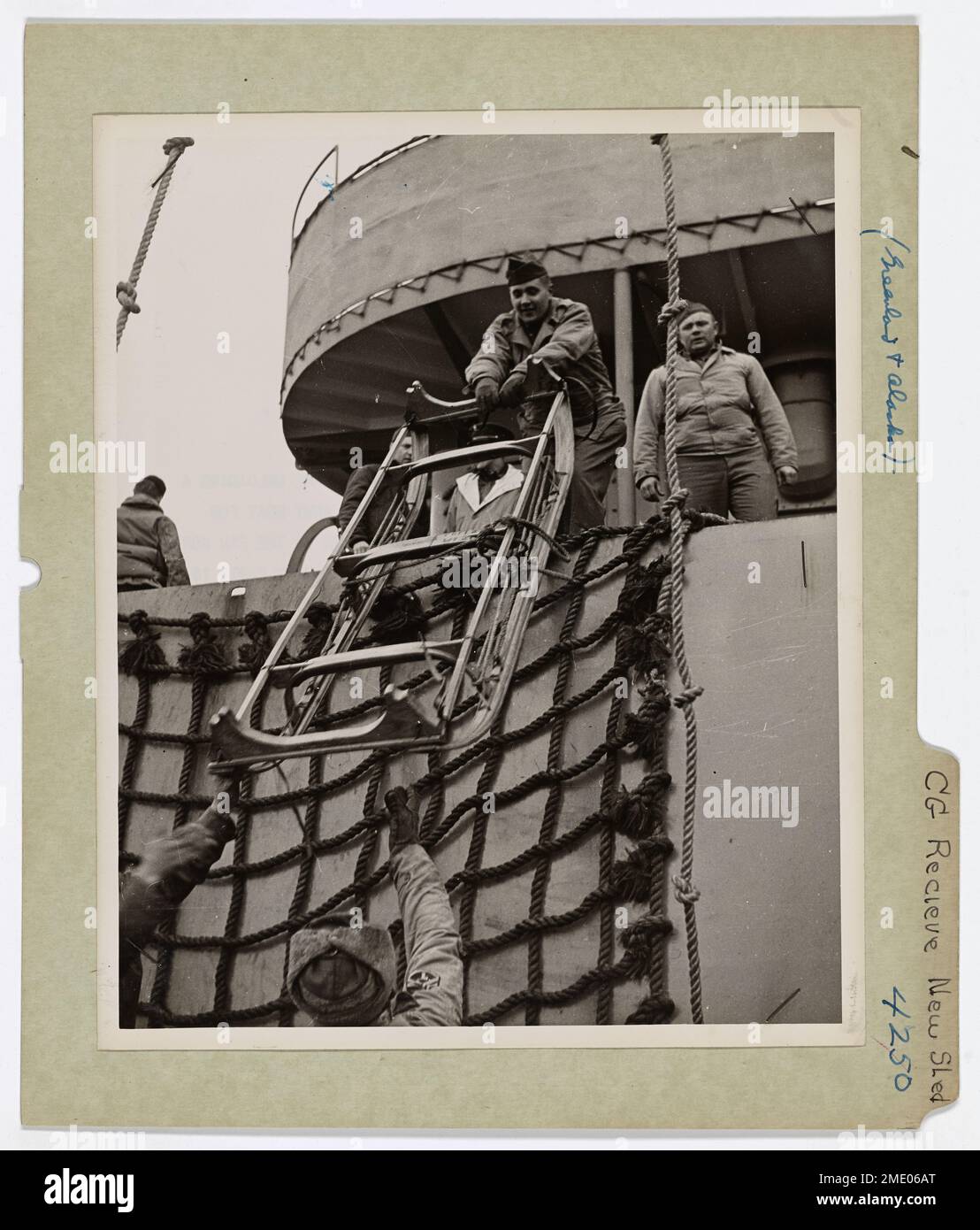 This image depicts U.S. Army personnel unloading a sled from a Coast ...