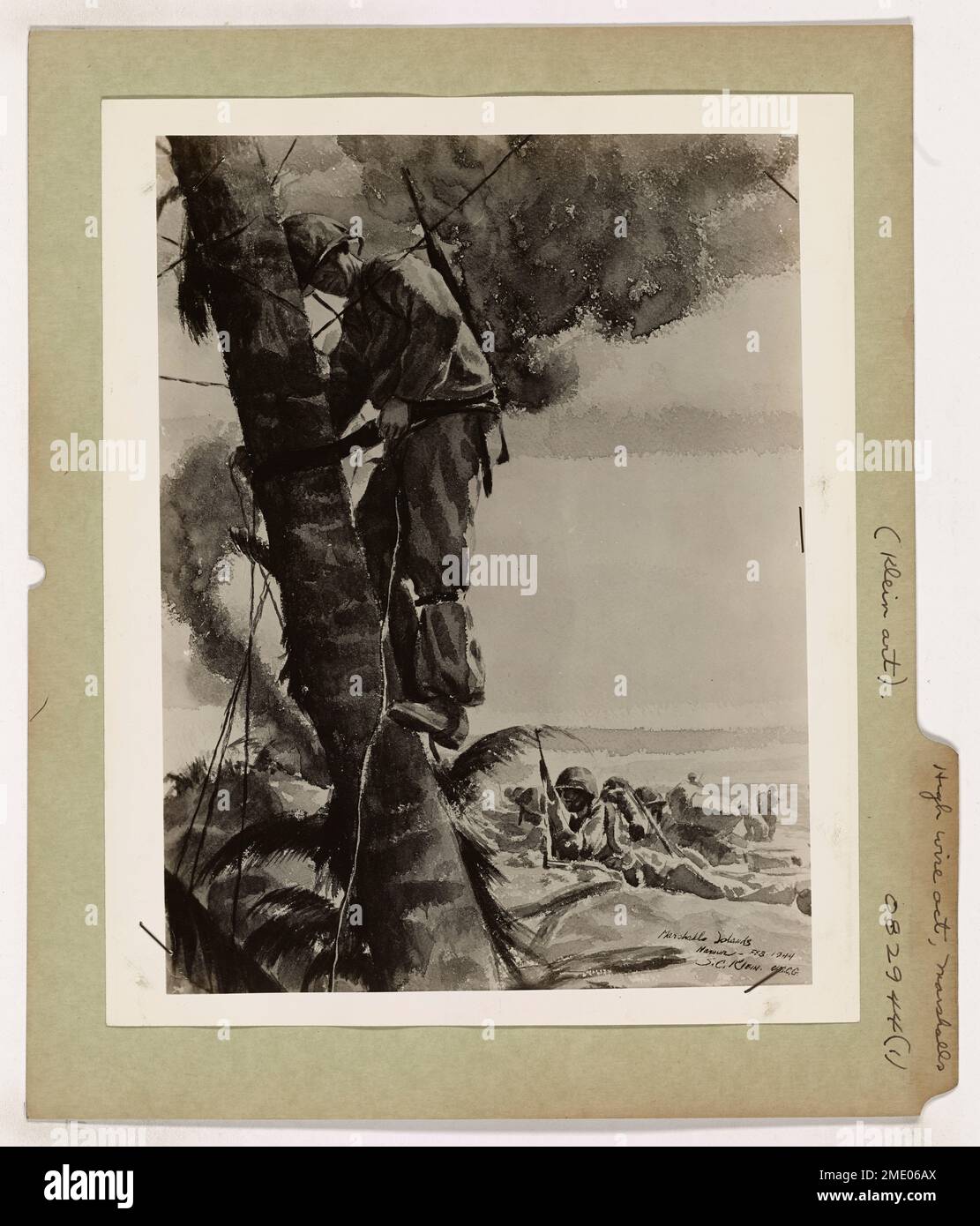 An American soldier places communication wires on Namur Island during ...