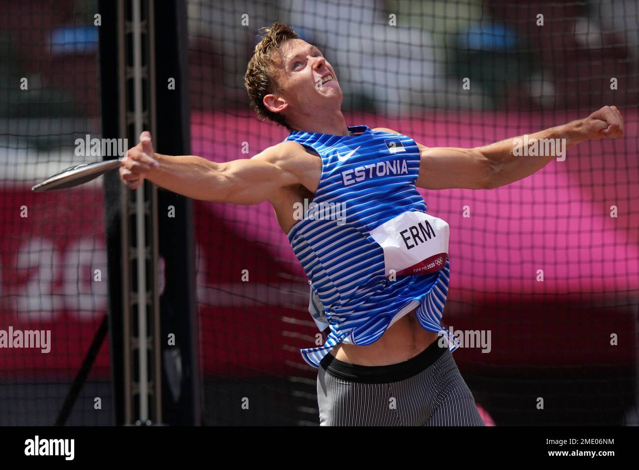 Johannes Erm, of Estonia, competes in the decathlon discus throw at the ...