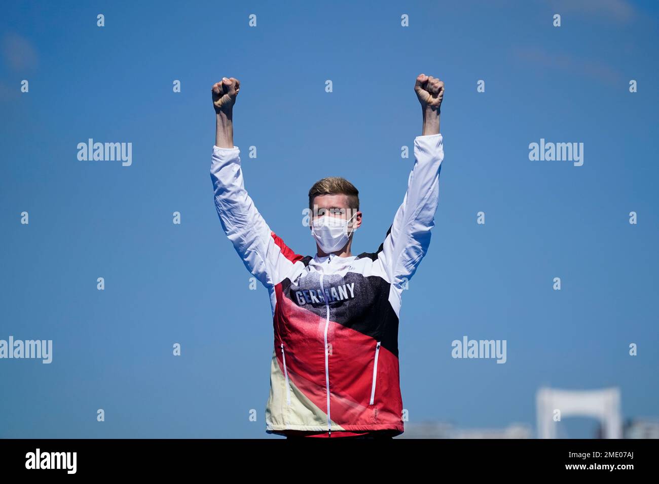 Florian Wellbrock, of Germany, celebrates his gold medal during a ...