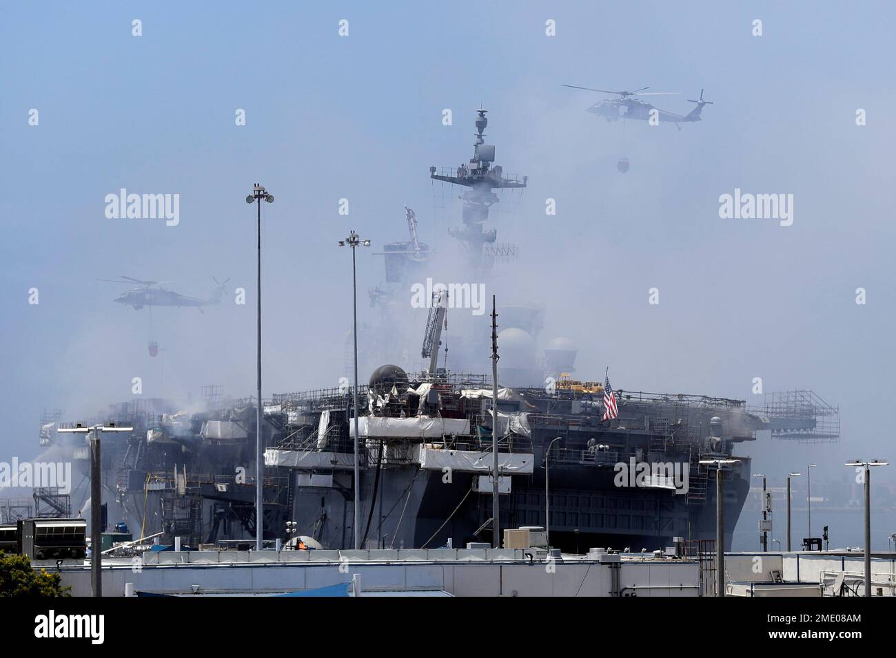 FILE - In this July 13, 2020, file photo, helicopters approach the USS ...