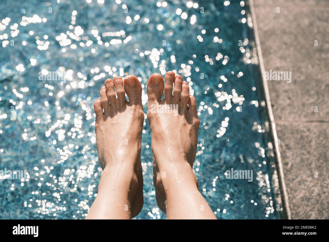 Women in swimming pool legs hi-res stock photography and images - Alamy