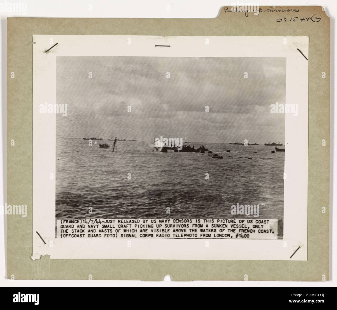 U.S. Coast Guard and Navy small craft recover survivors from a sunken ...