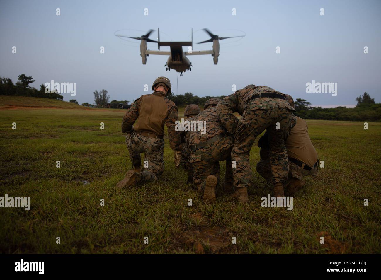 U.S. Marines with Marine Wing Support Squadron (MWSS) 171 fast rope out ...