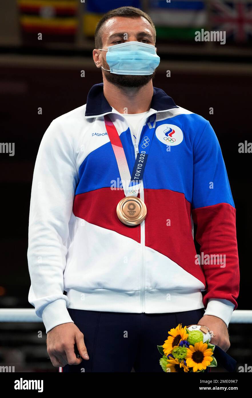 Bronze medalist Imam Khataev of Russian Olympic Committee, stand during ...