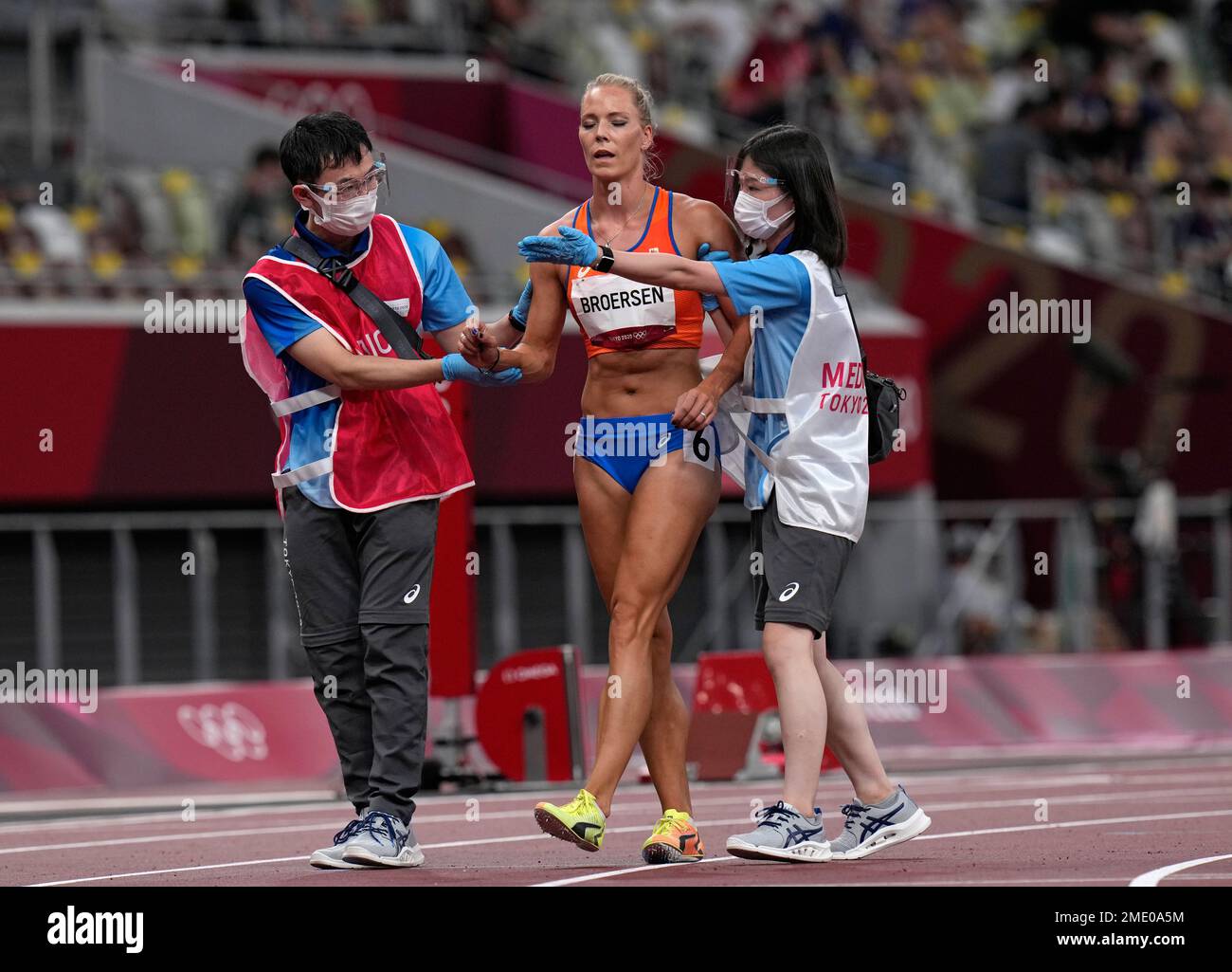 Nadine Broersen, of Netherlands is assisted by officials after ...