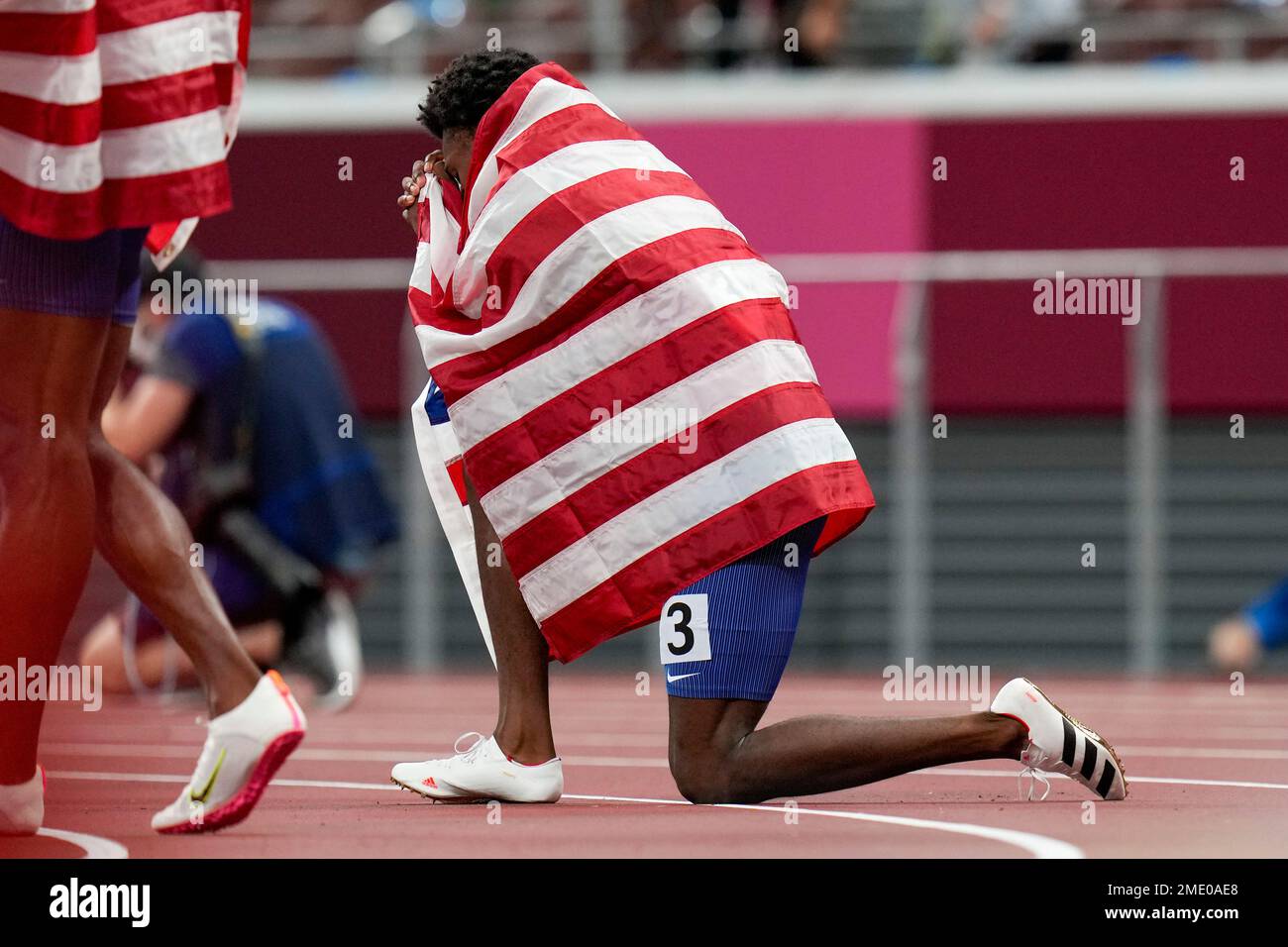 Bronze medalist Noah Lyles, of the United States, reacts after the men ...