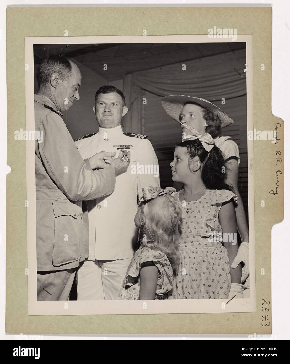 Vice Admiral Russell R. Waesche presents the Legion of Merit Medal to ...