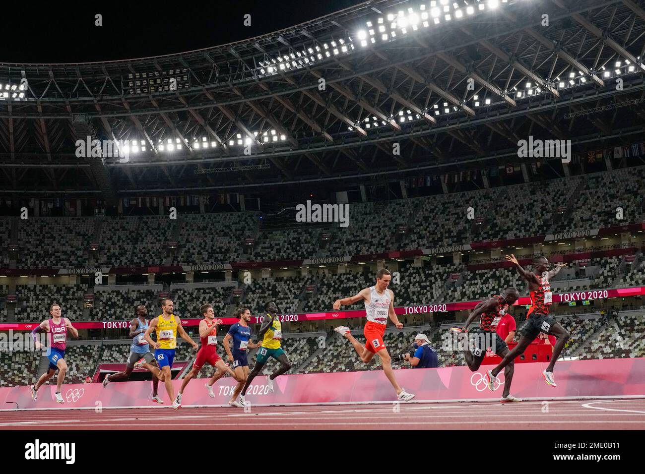 Emmanuel Korir, right, of Kenya, celebrates after winning the gold ...