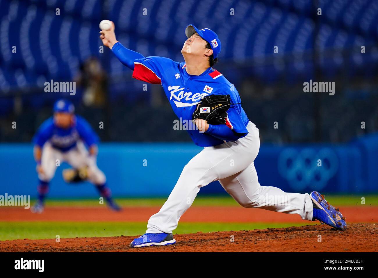 South Korea's Sangwoo Cho pitches during a semi-final baseball game ...