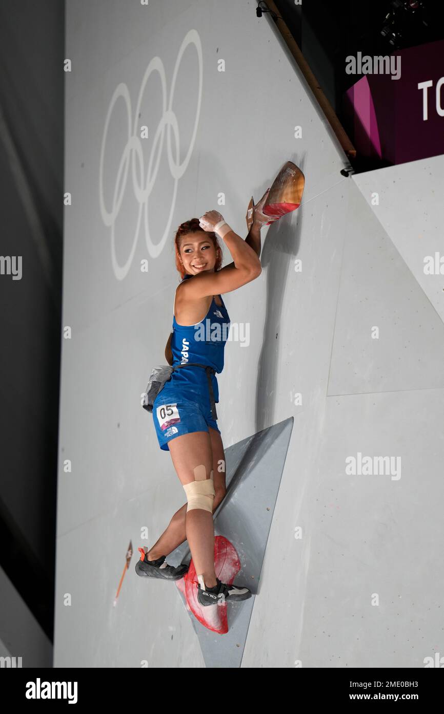 Miho Nonaka, of Japan, celebrates after reaching the top during the ...