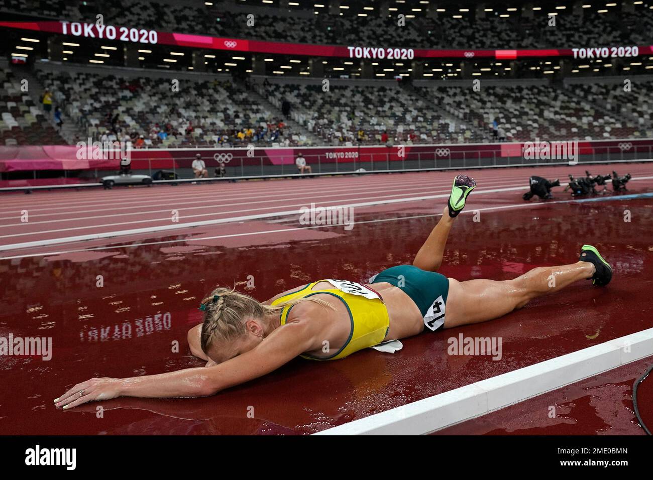 Genevieve Gregson, of Australia, lies on the track after a fall in the ...