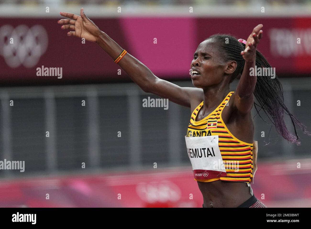 Peruth Chemutai, of Uganda, celebrates as she crosses the finish line ...