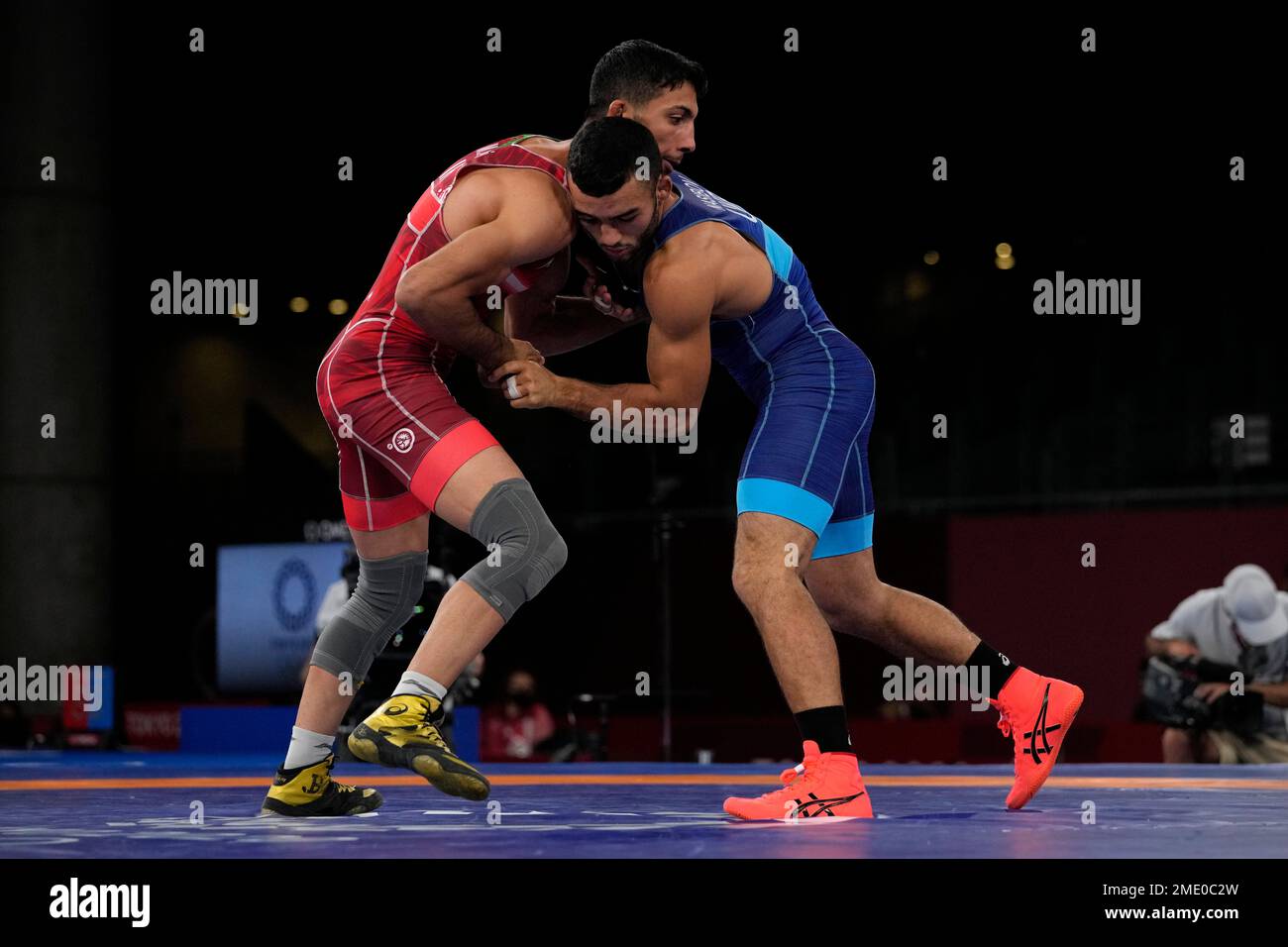 Iran's Mohammedreza Geraei, left, and Ukraine's Parviz Nasibov compete ...