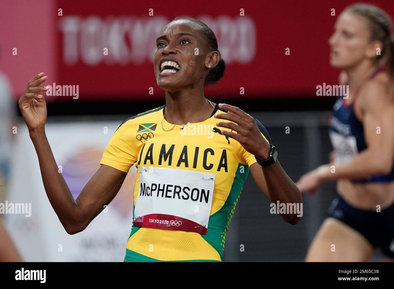 Stephenie Mcpherson, of Jamaica, reacts following a semifinal of the ...