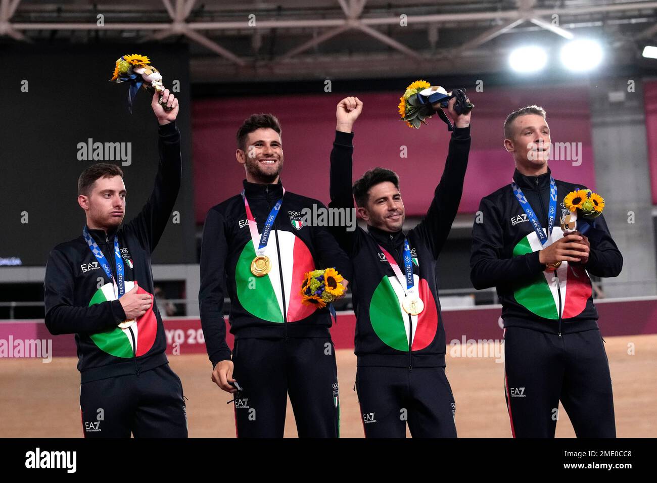 Team Italy waves with their gold medals during a medal ceremony for the ...
