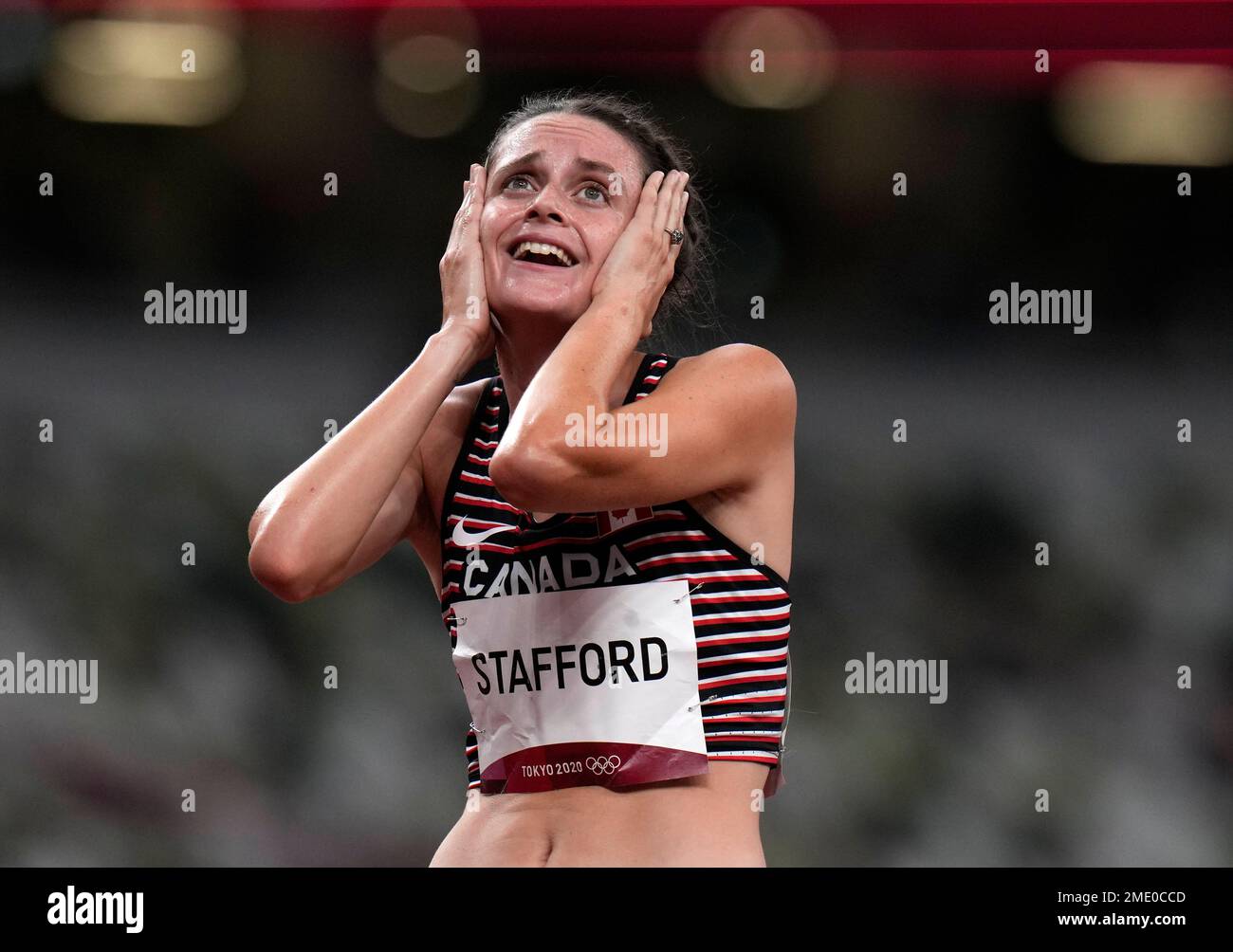 Lucia Stafford, of Canada reacts after finishing a women's 1,500-meter ...