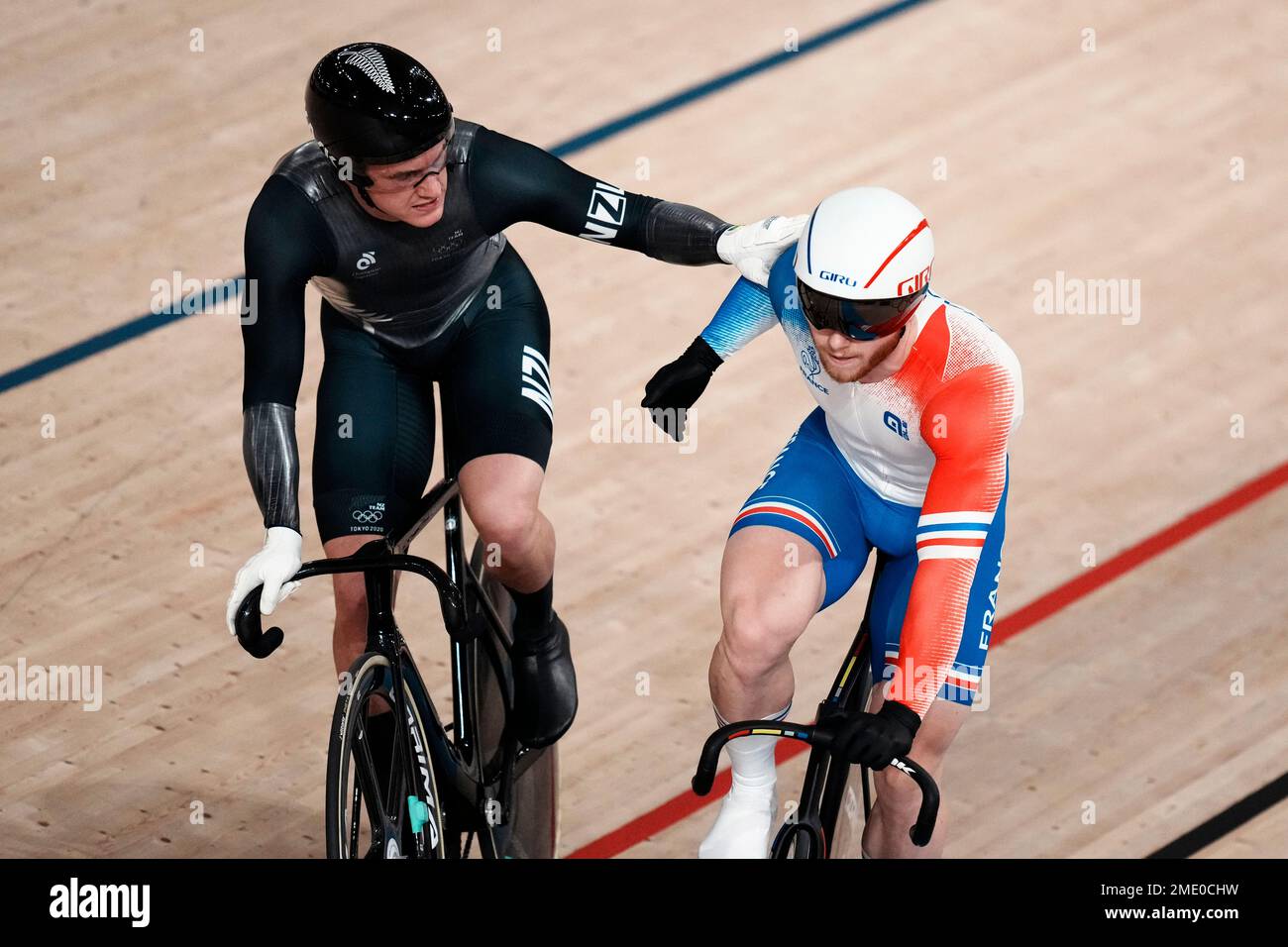 Sam Webster of Team New Zealand congratulates Sebastien Vigier of Team ...