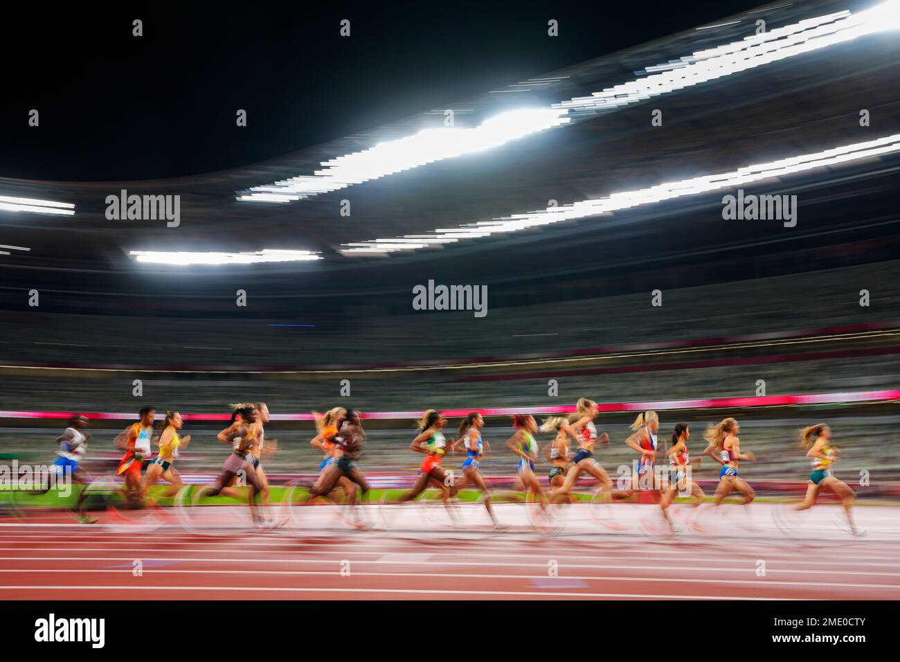 Runners compete in a heat of the women's 5,000-meter run at the 2020 ...