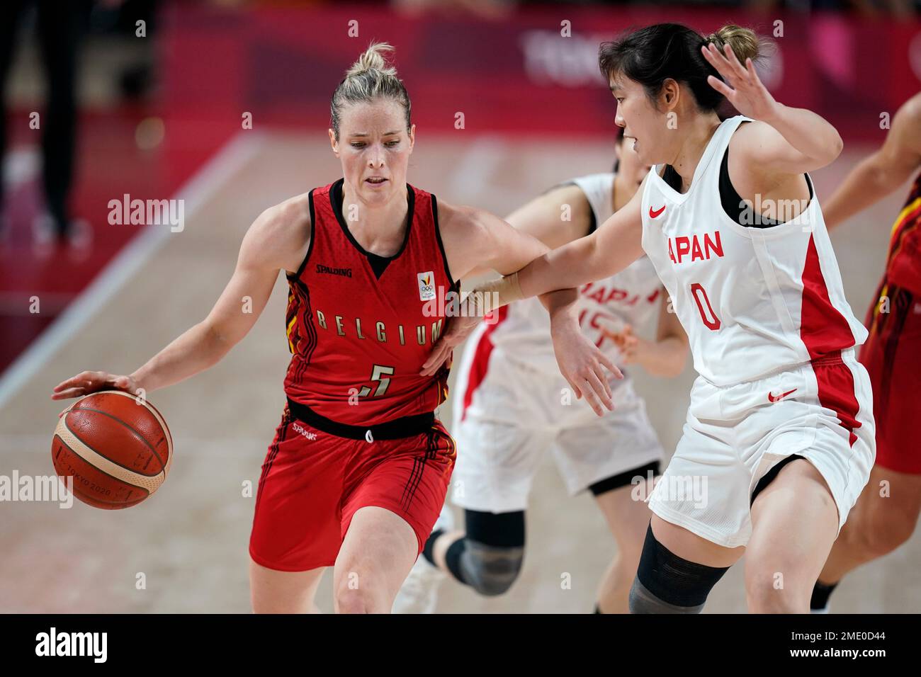 Belgium's Kim Mestdagh (5) drives up court past Japan's Moeko Nagaoka ...