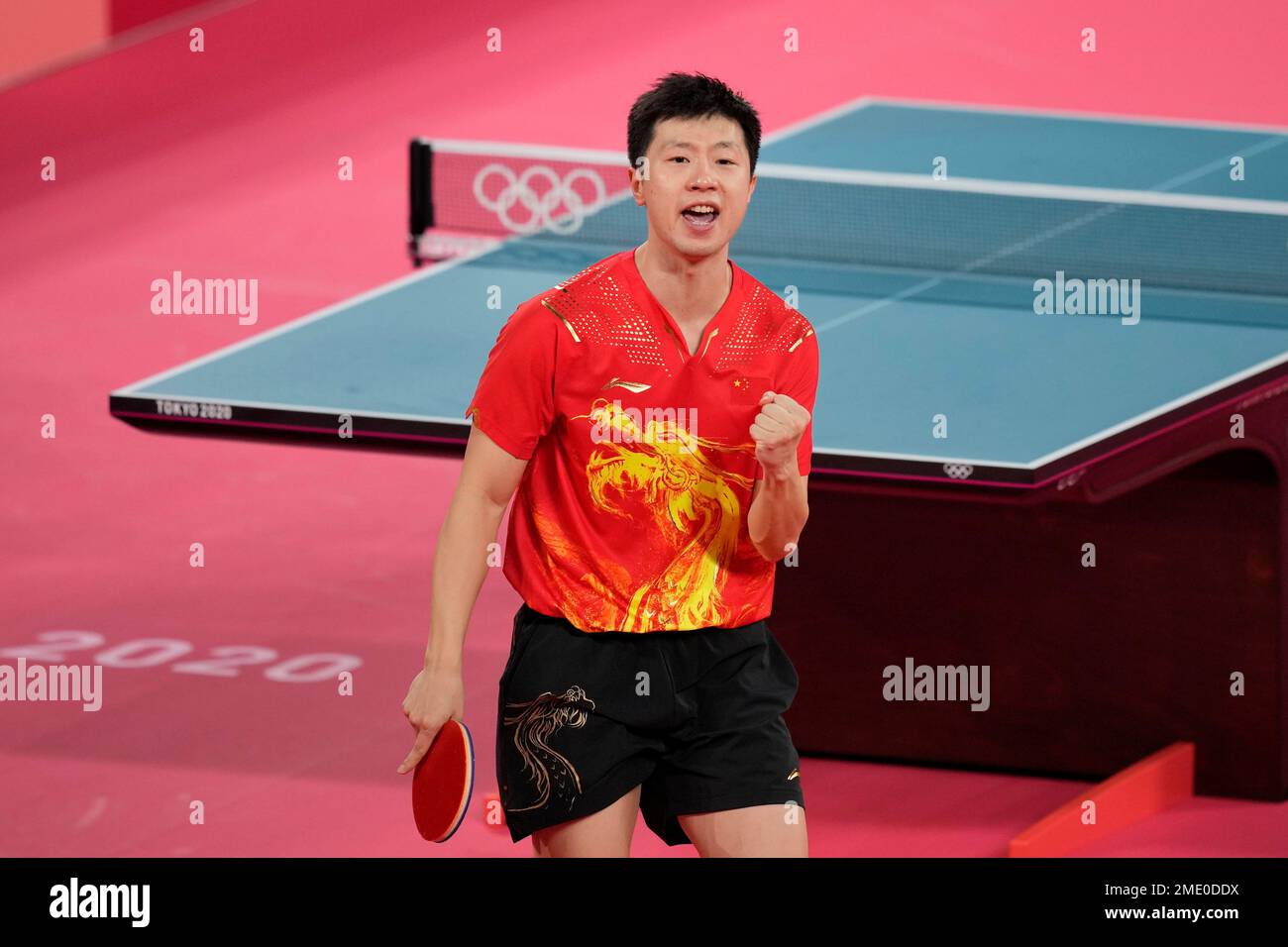 China's Ma Long celebrates during the table tennis men's team semifinal ...