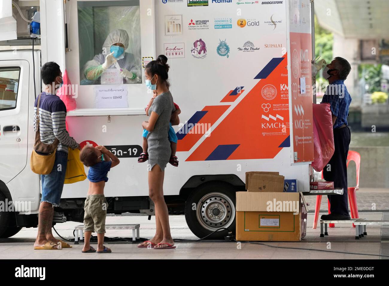 Health workers collect nasal swabs from locals for coronavirus testing ...